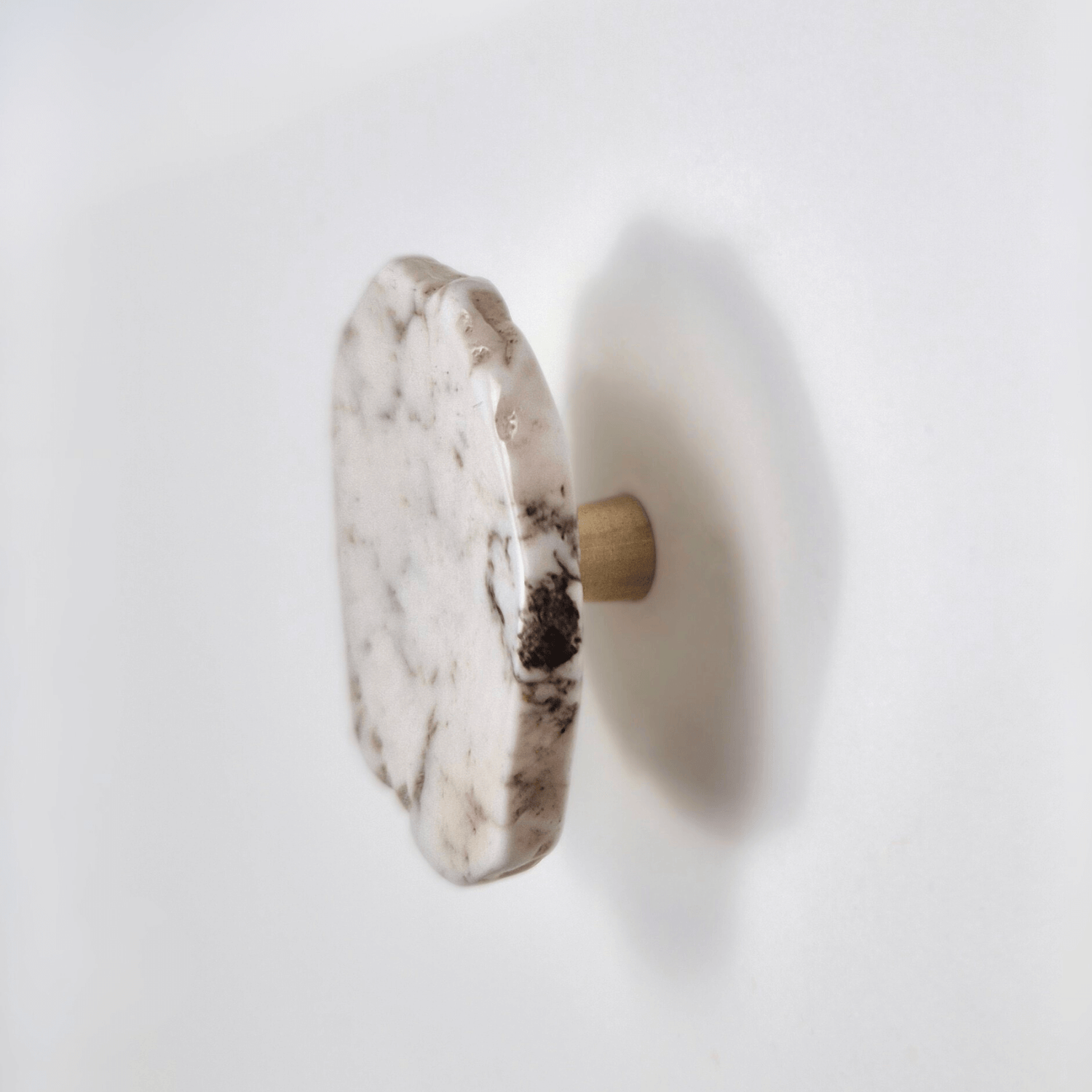 Marble stone wall hook with brass detail
